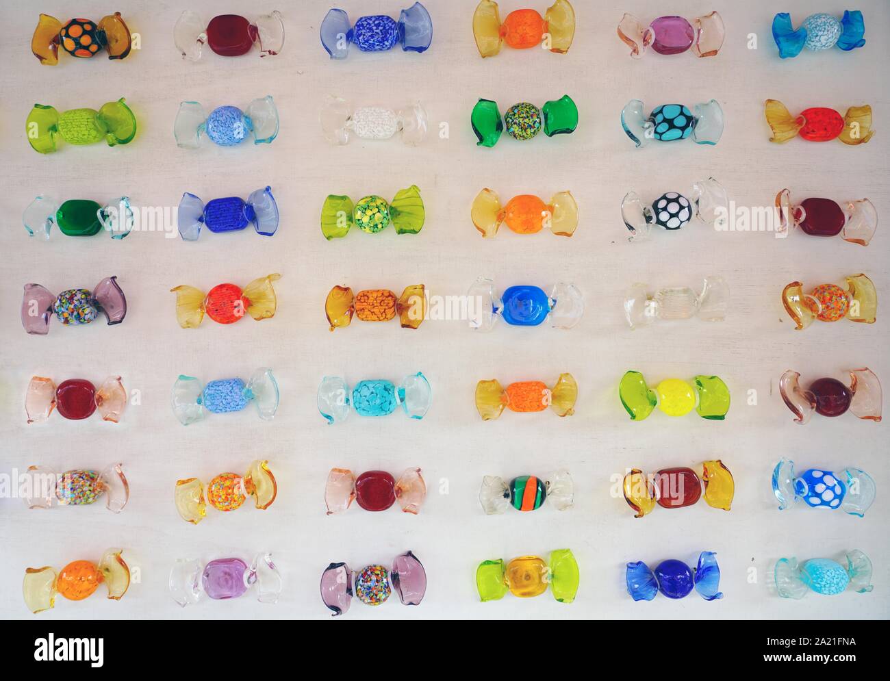 Wall display of decorative candies made of Murano glass Stock Photo - Alamy