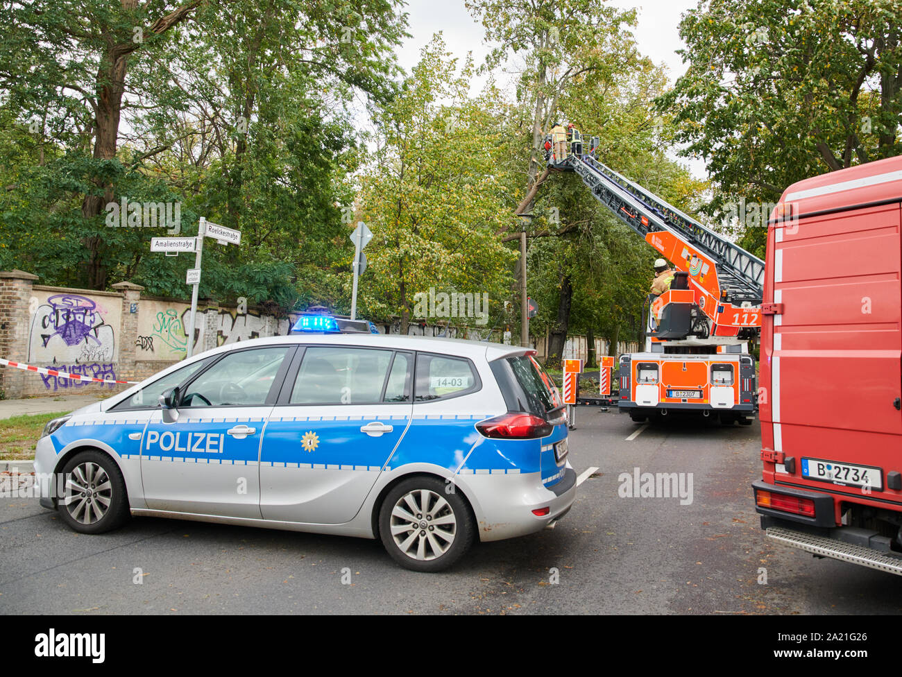 Berlin, Germany. 30th Sep, 2019. Firefighters dismember a tree in ...