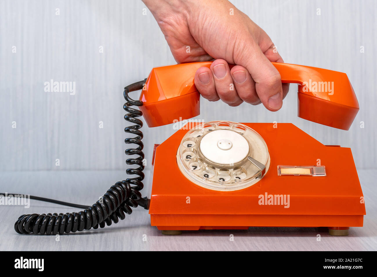 Hand picking up telephone hi-res stock photography and images - Alamy