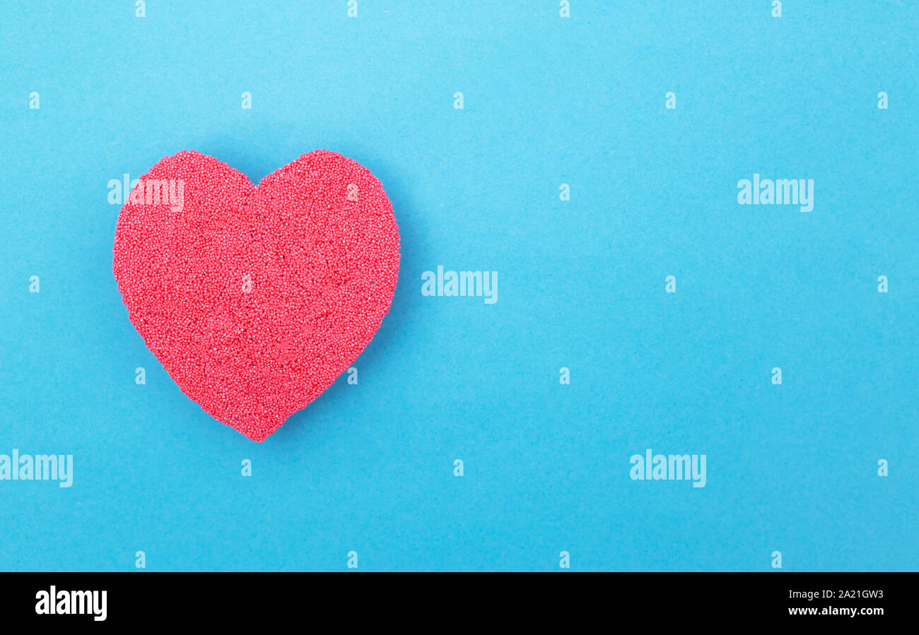 Red heart on a blue background. Concept of human heart disease and ...