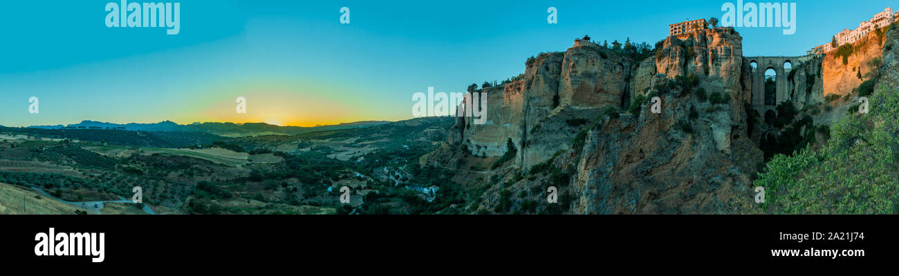A panorama picture of Ronda overlooking the surrounding landscape at ...