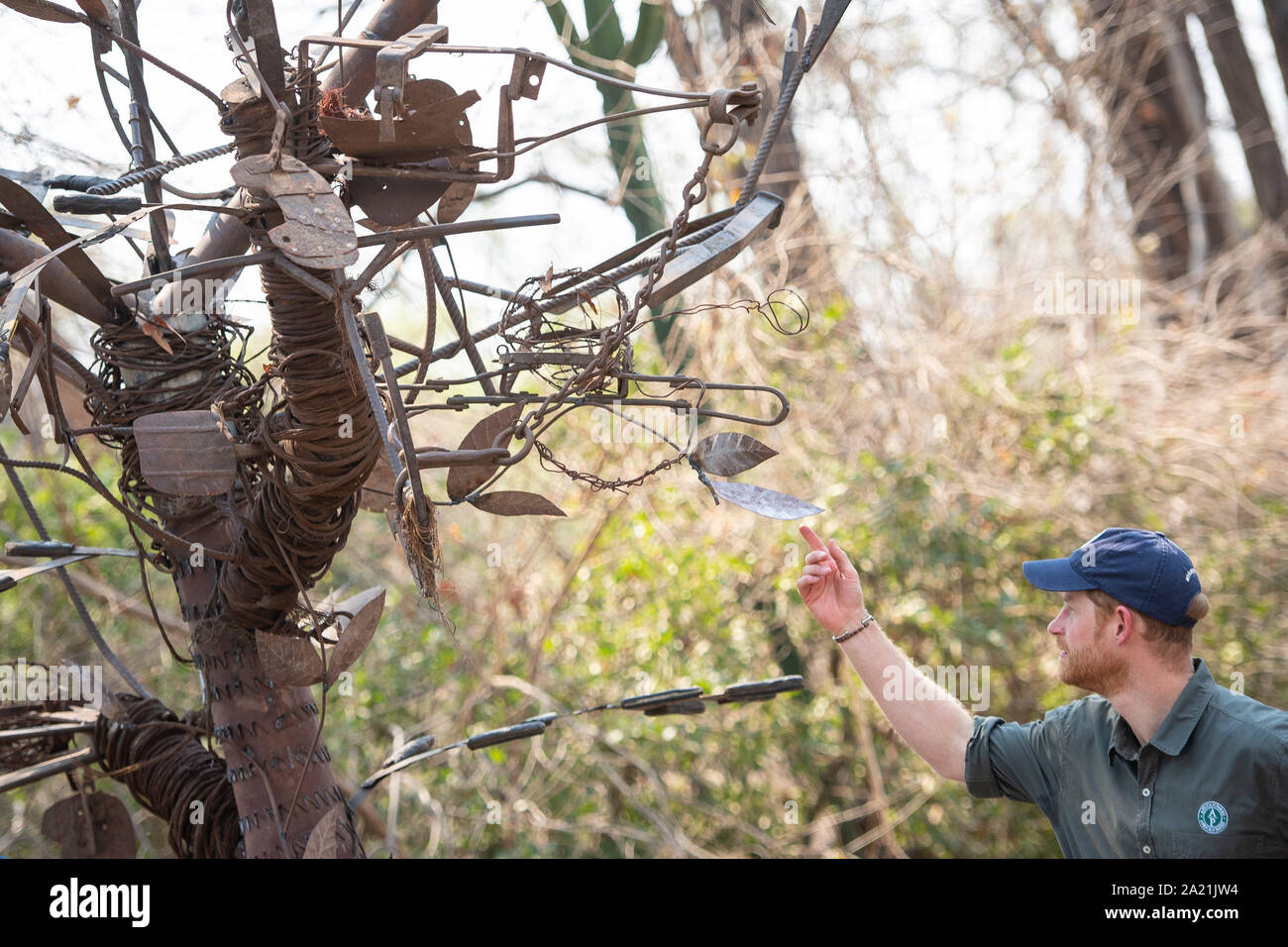 The Duke of Sussex views a tree sculpture made from poacher's snares ...