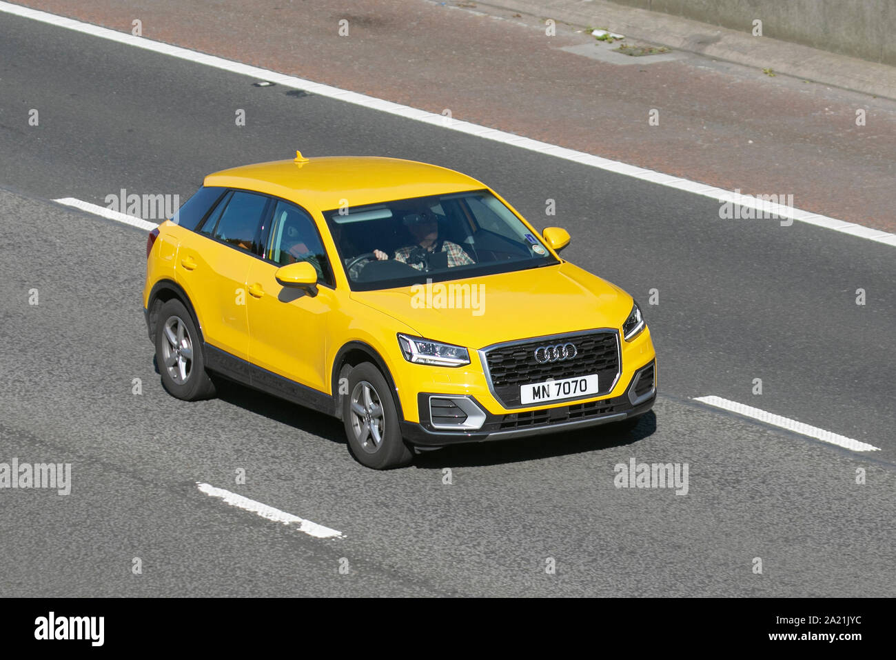Yellow Audi A3 SE TDI Auto driving on the M6 in Lancaster, UK Stock ...