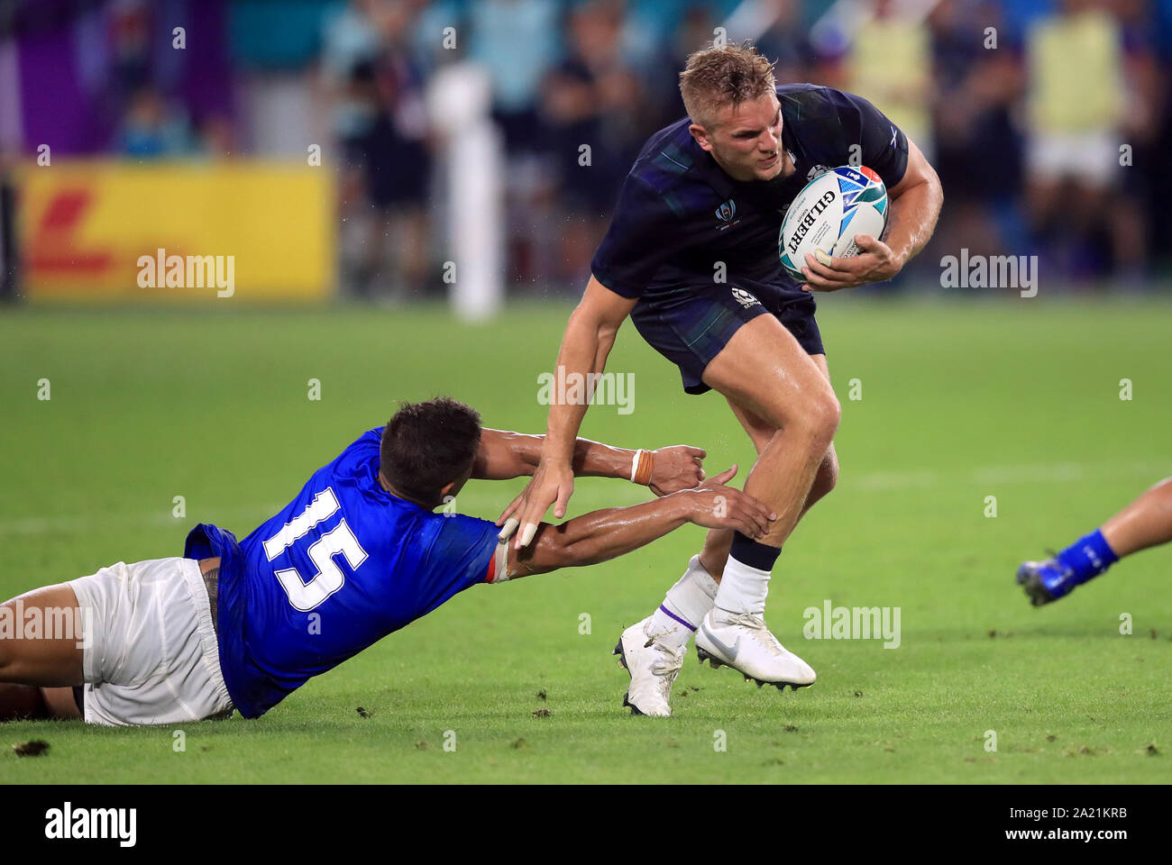 Scotland's Chris Harris evades the tackle from Samoa's Tim Nanai ...