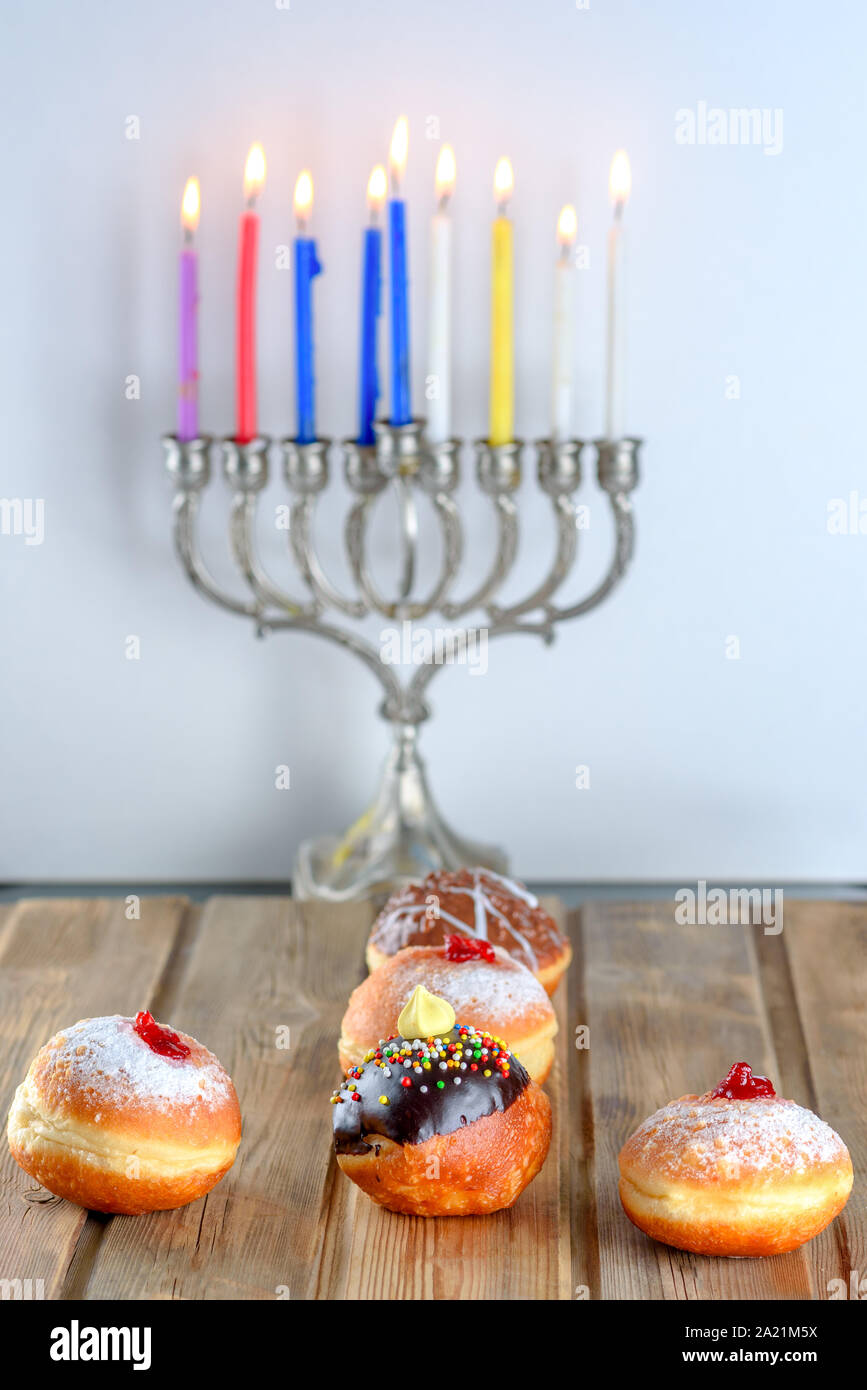 Round jelly doughnut sufganiyot and chocolate sufganiyah for Hanukkah ...