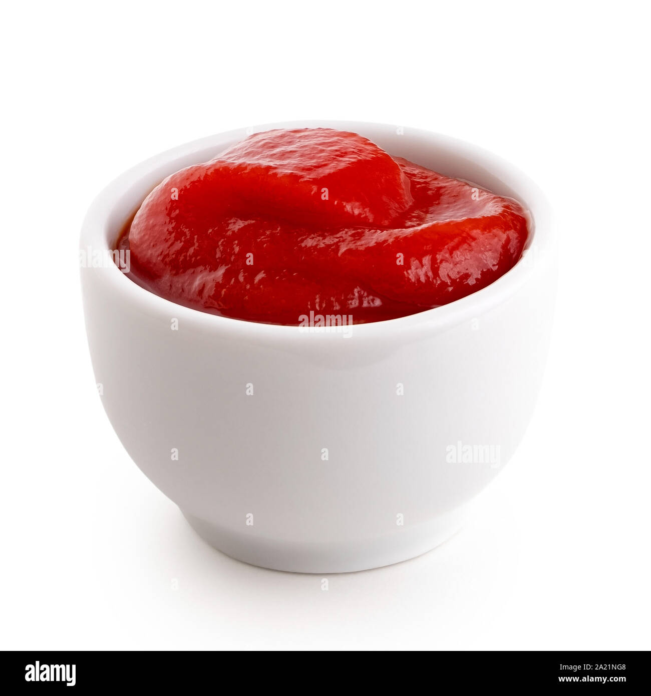 Tomato ketchup in small white ceramic dish isolated on white Stock ...