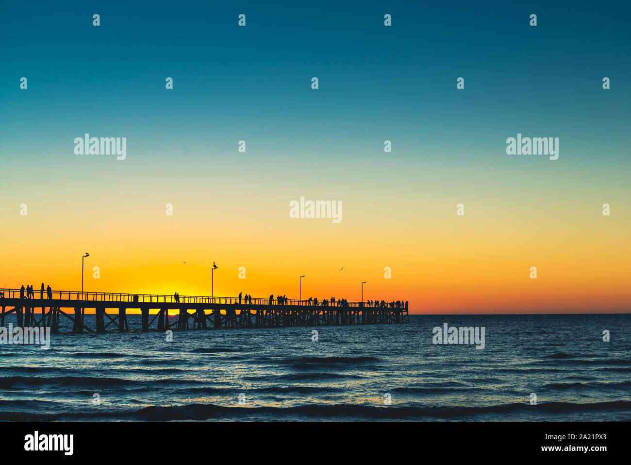 Semaphore Beach jetty with people enjoying spectacular sunset, South ...