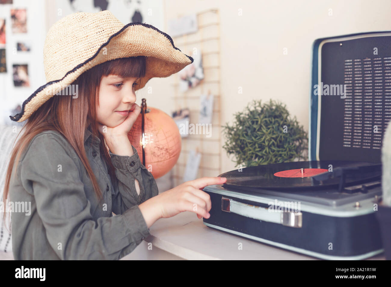 Little girl and vinyl player. Concepts of music and technologies of ...