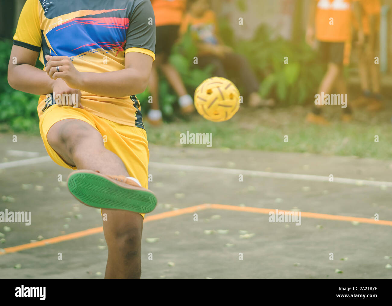 Students playing traditional asian sport game sepak takraw in school ...