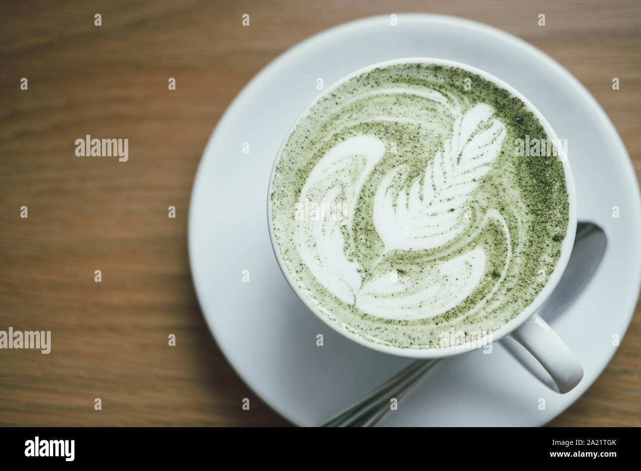 hot matcha green tea latte on wood table. delicious beverage Stock ...