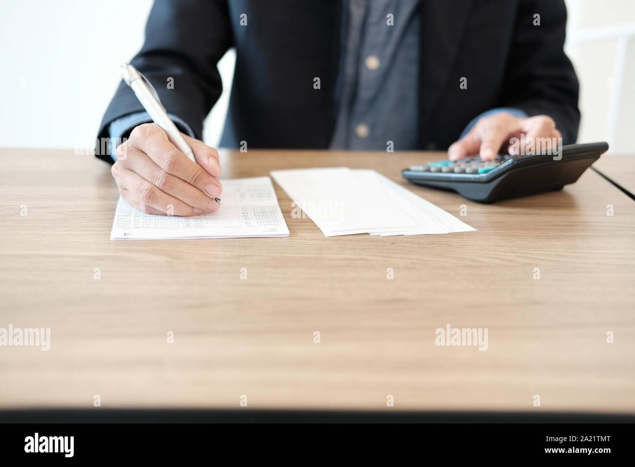 man calculate domestic bills. Businessman with calculator checking ...