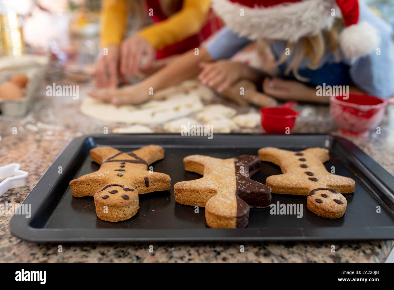 Making gingerbread man cookies hi-res stock photography and images - Alamy