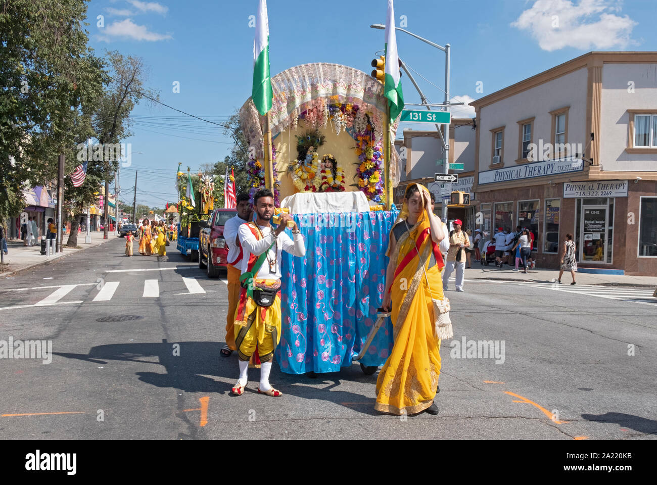 Worshippers pull a float with statues of Hindu deities in the Madrassi ...