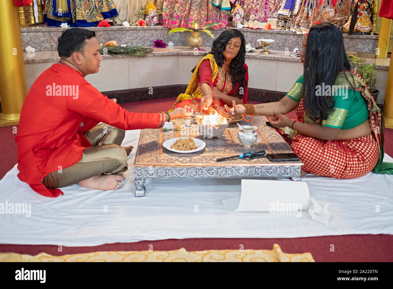 At the beginning of services for Navarati, a Hindu priestess (green ...