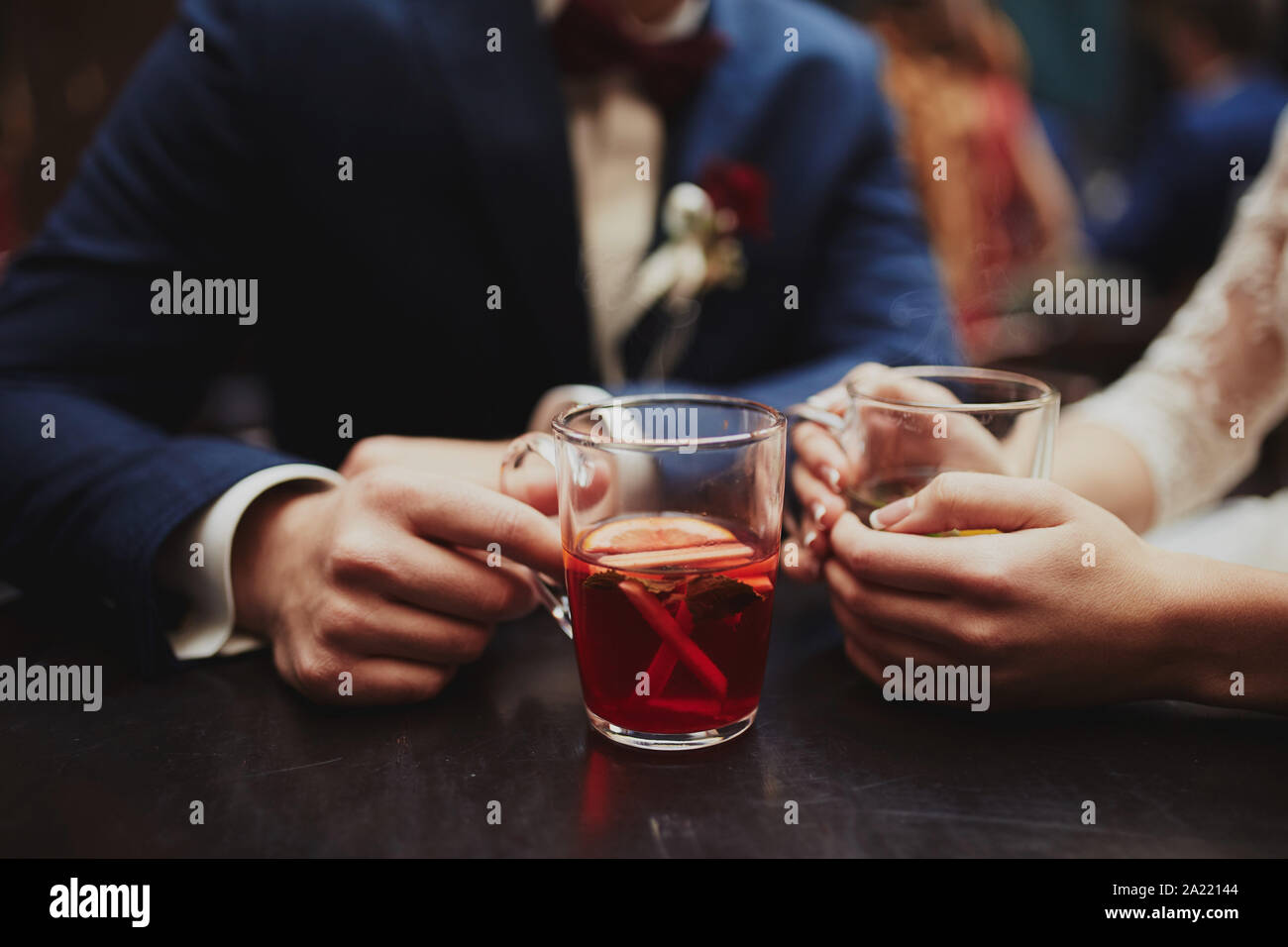 The bride and groom drink tea at the time of the wedding photo shoot ...