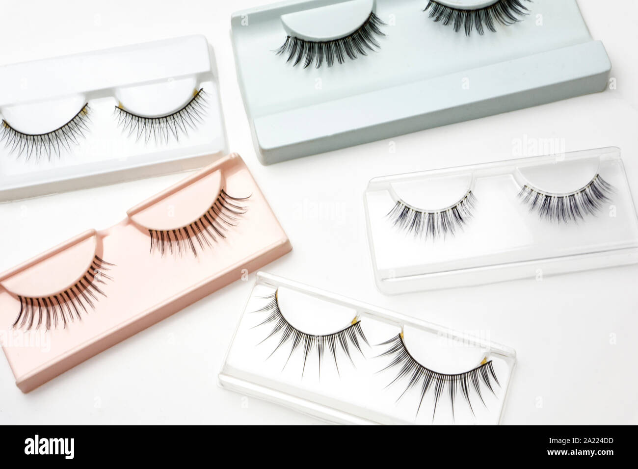 false eye lashes on white background Stock Photo - Alamy