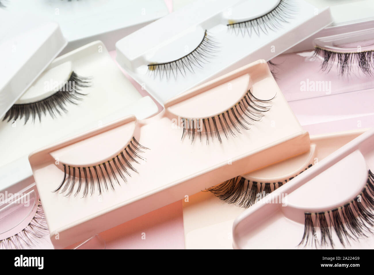 false eye lashes on white background Stock Photo - Alamy