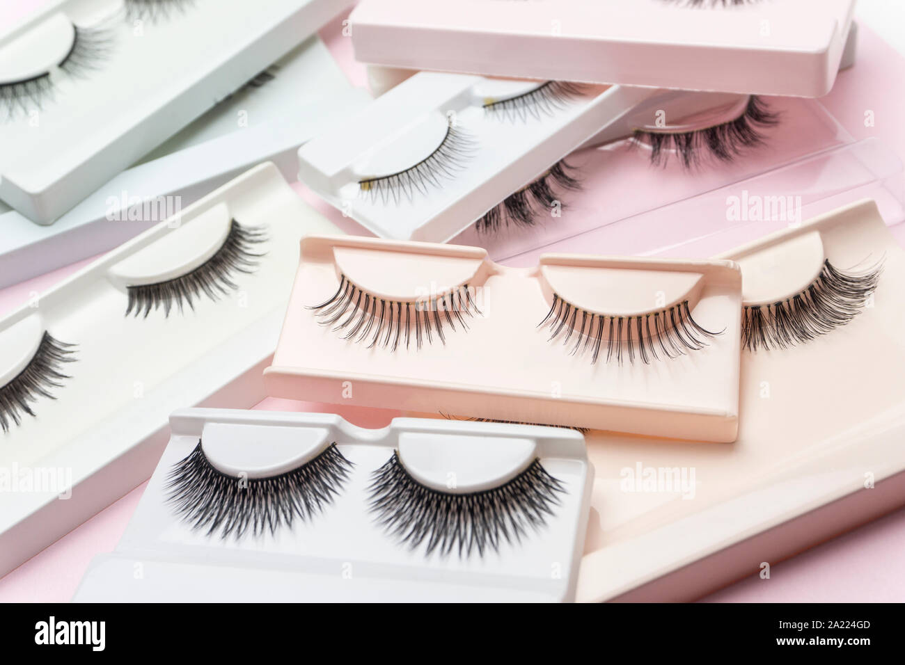 false eye lashes on white background Stock Photo - Alamy