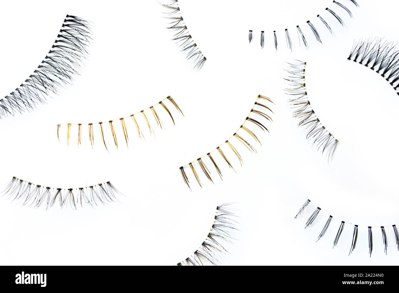false eye lashes on white background Stock Photo - Alamy