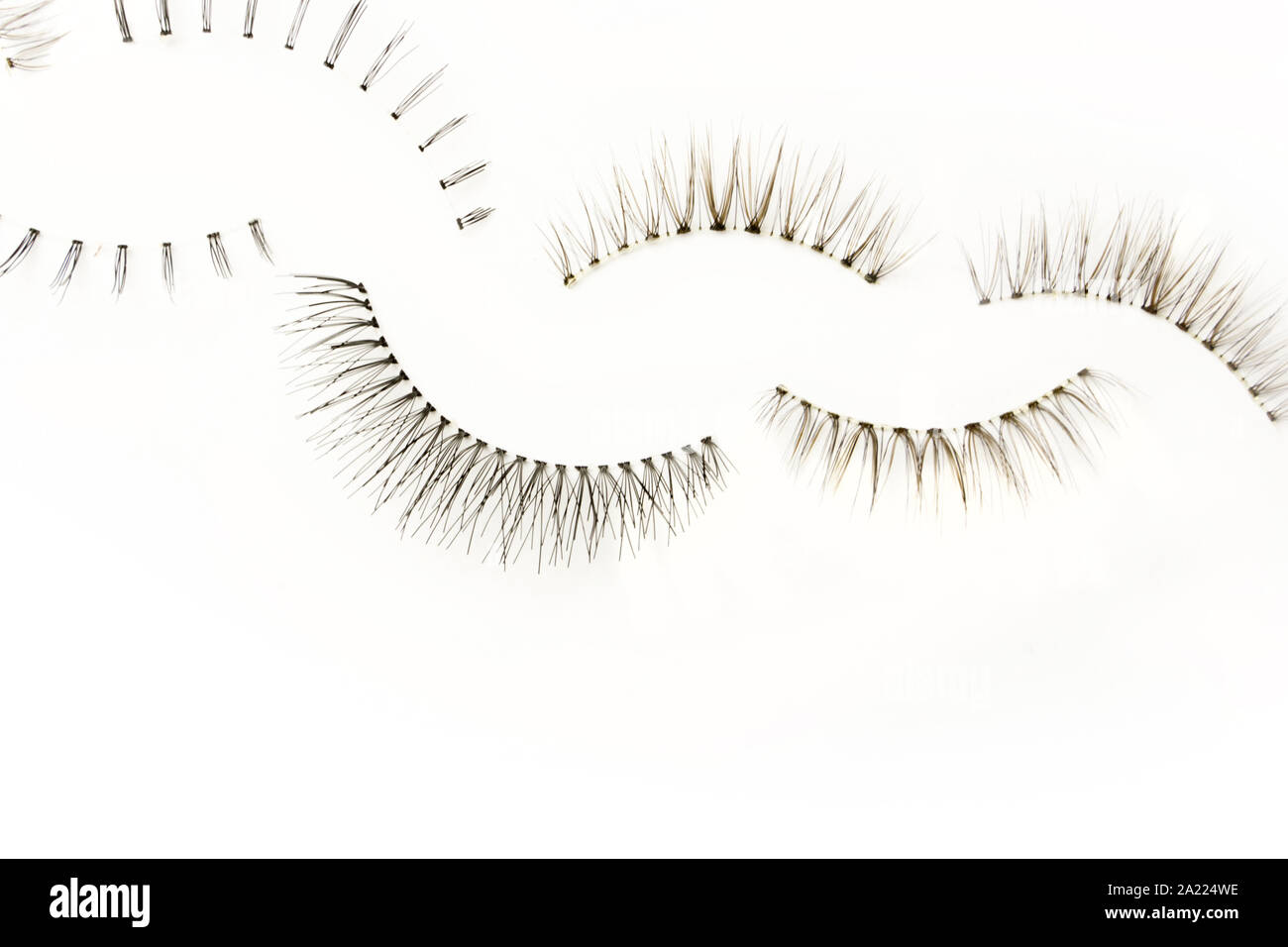 false eye lashes on white background Stock Photo - Alamy