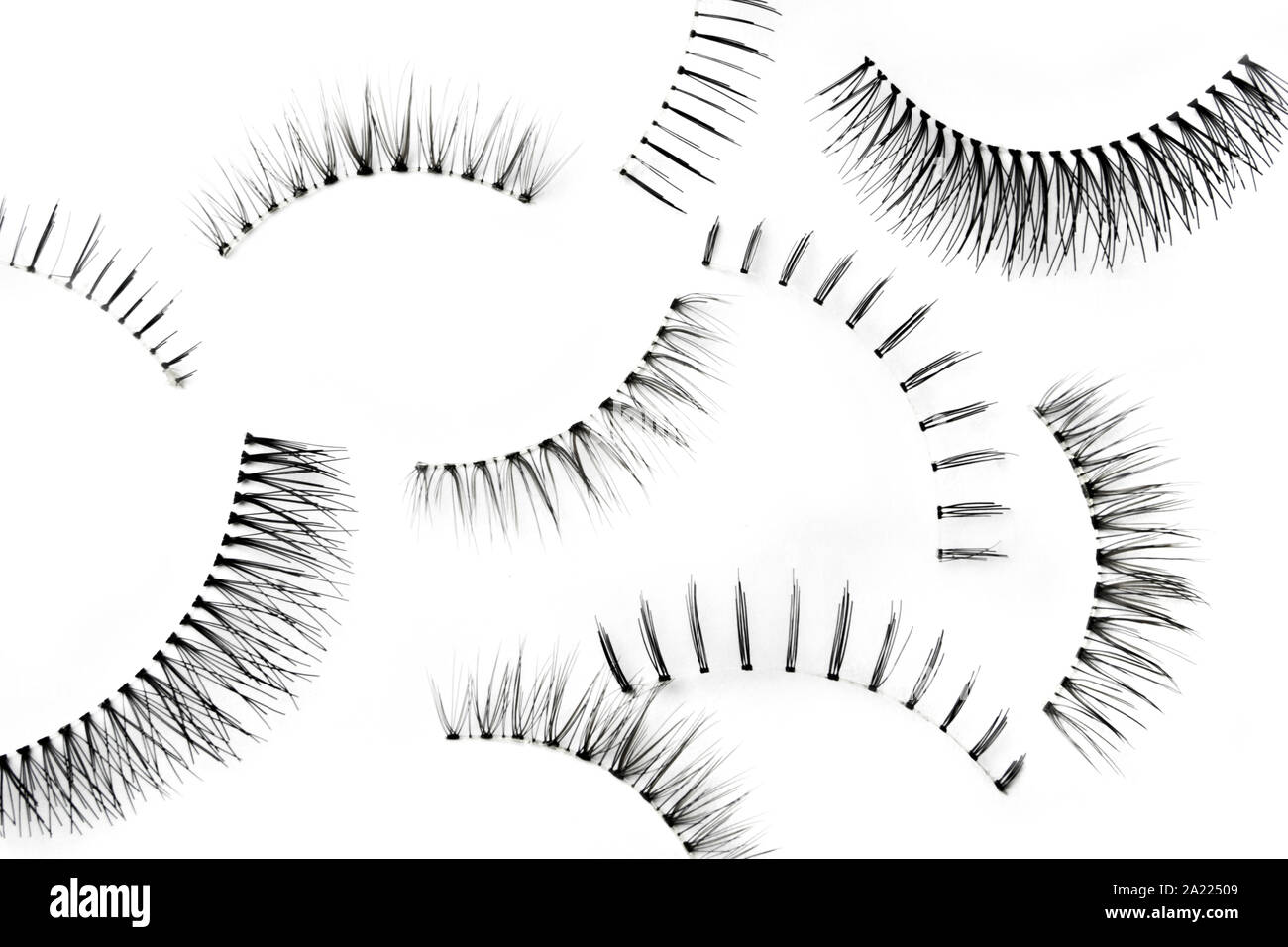 false eye lashes on white background Stock Photo - Alamy