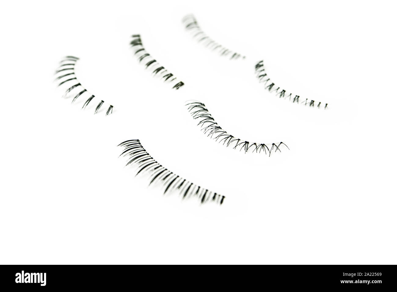 false eye lashes on white background Stock Photo - Alamy