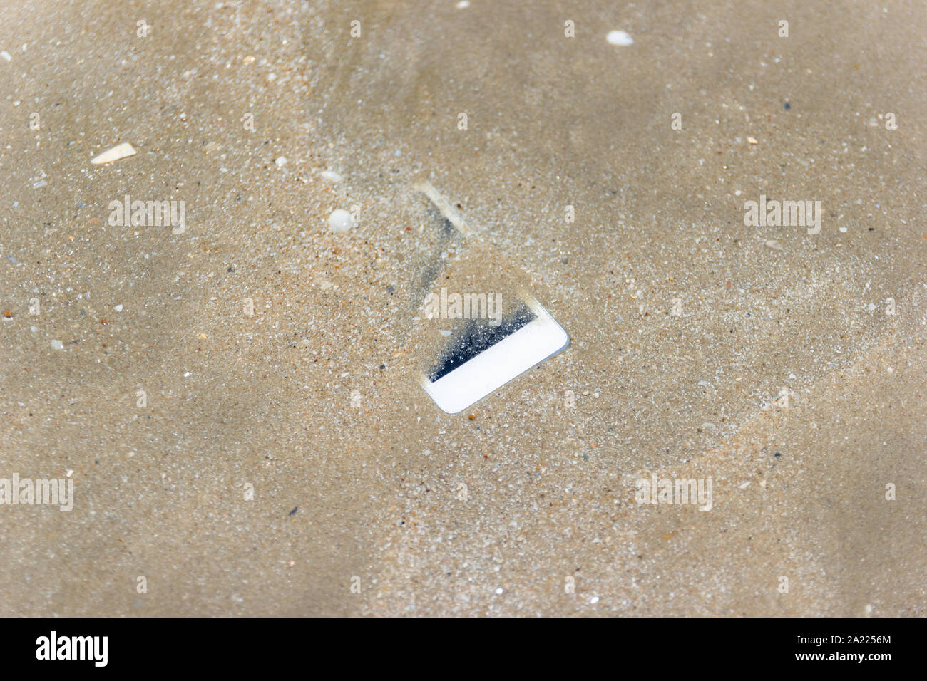 White Mobile phone floated to the sea at the beach Stock Photo - Alamy