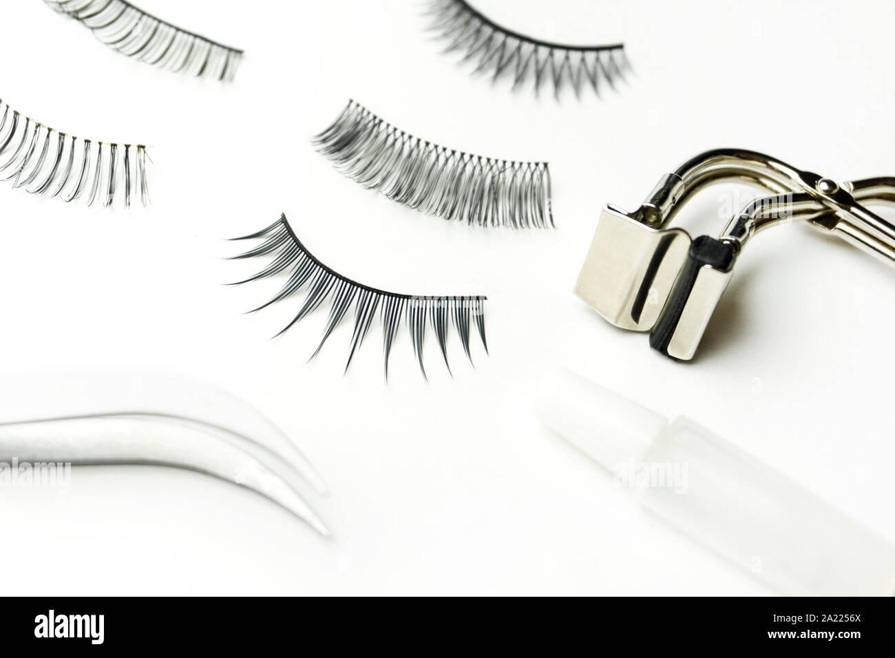 false eye lashes on white background Stock Photo - Alamy