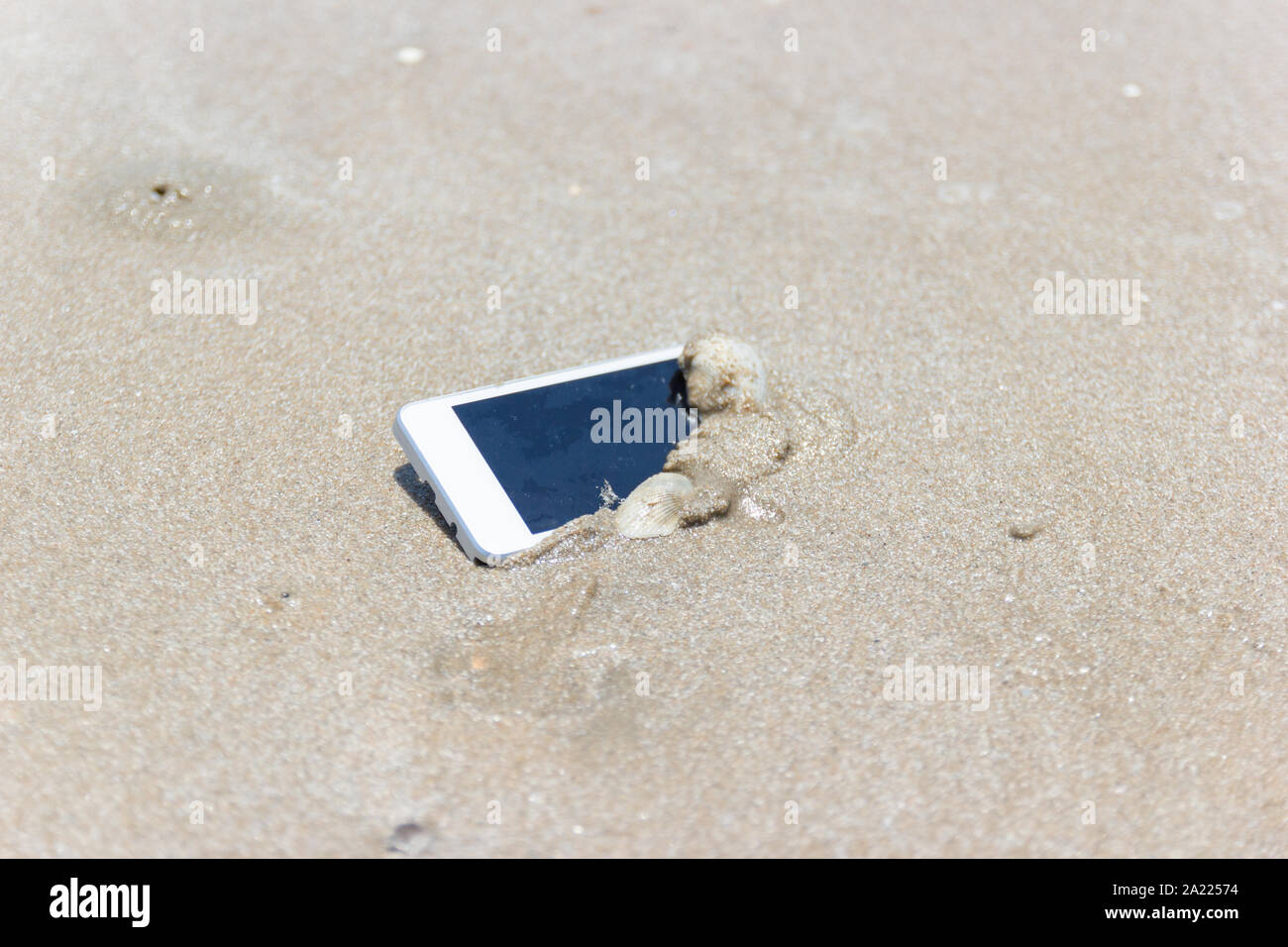 White Mobile phone floated to the sea at the beach Stock Photo - Alamy