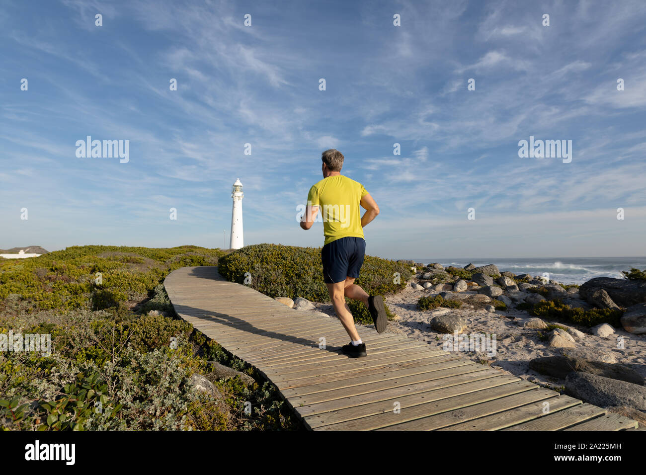 Man running by the sea Stock Photo - Alamy