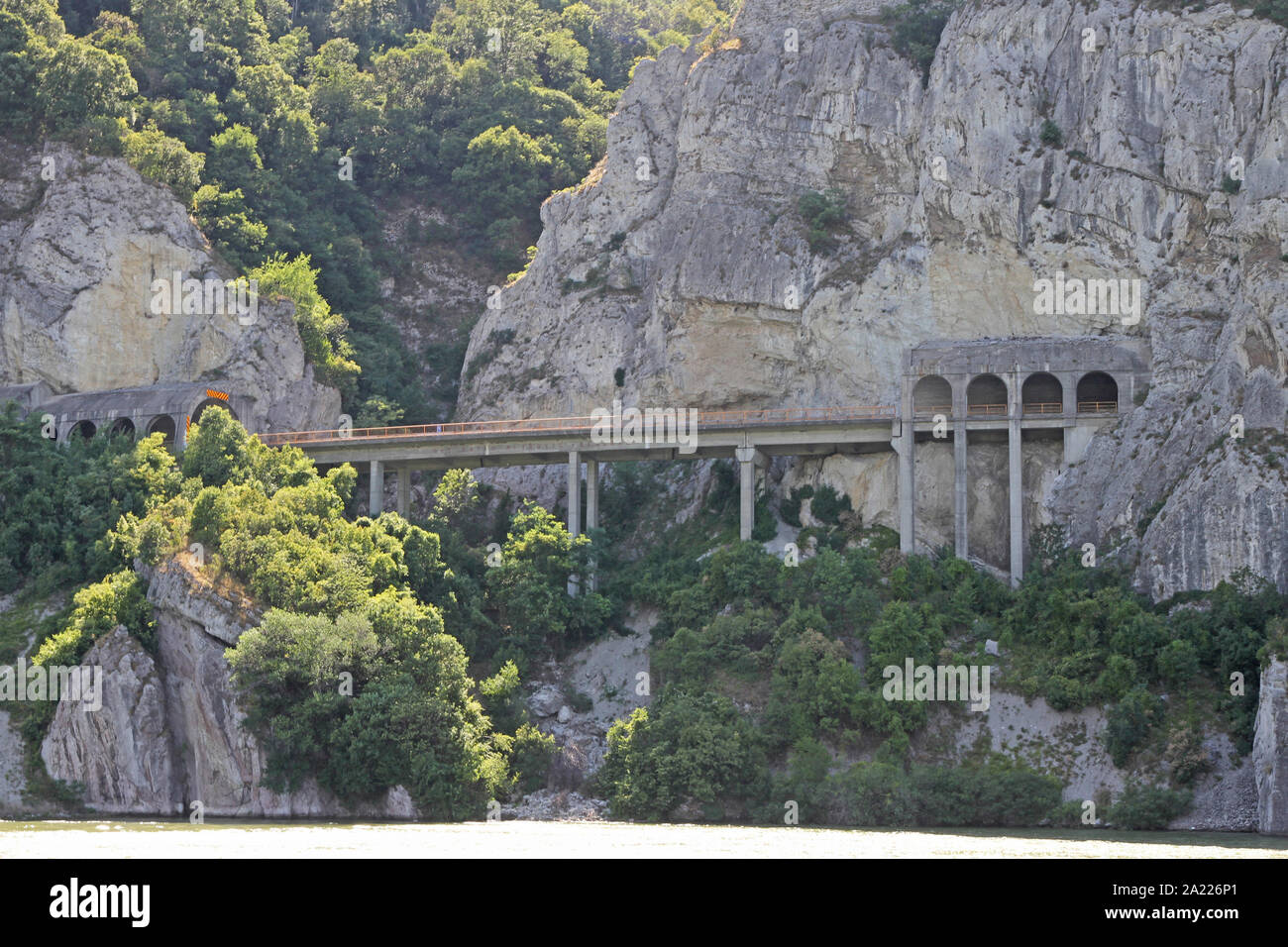 The Route 34 highway bridge and tunnel with arches running over side of ...