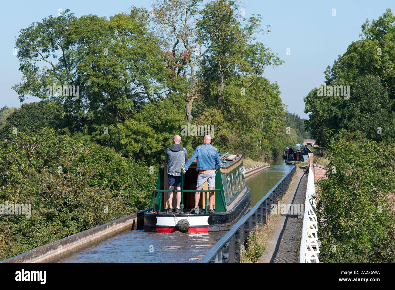 A narrowboat crosses the Edstone Aqueduct during a warm and pleasant ...