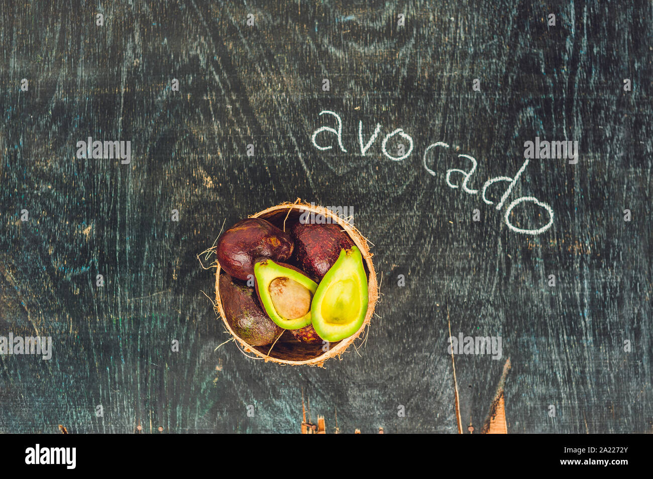 Fresh organic avocado on dark old wooden table, side view Stock Photo ...