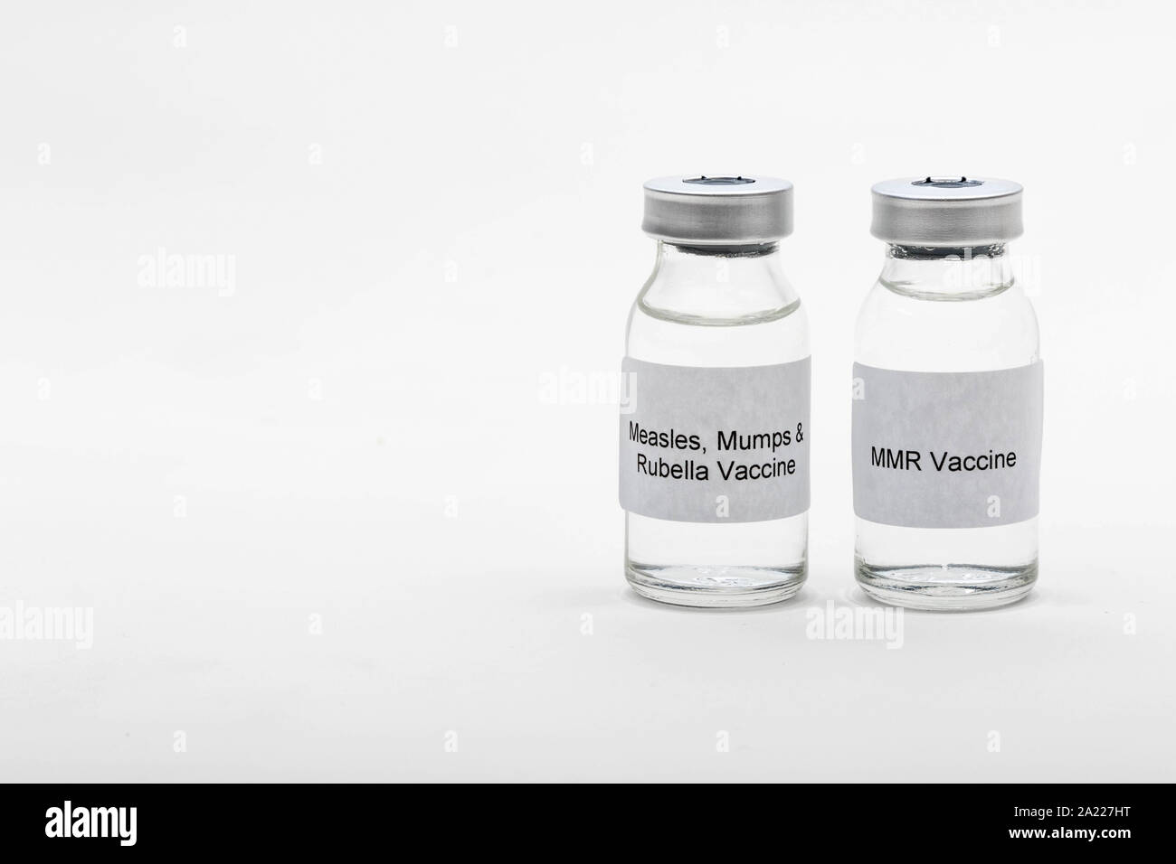 Medical concept showing medical 2 medical vials reading MMR Vaccine and ...