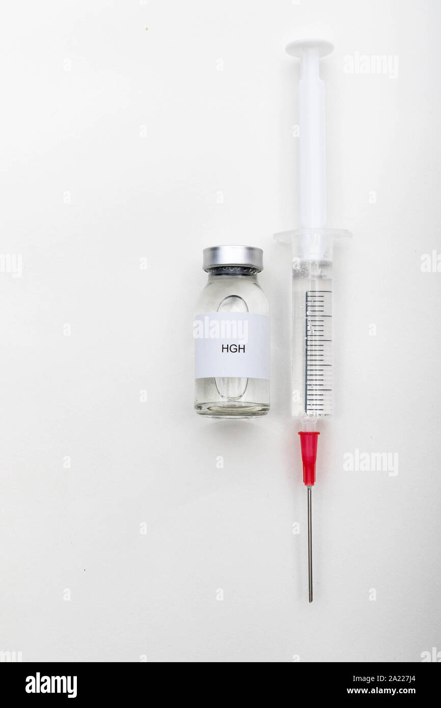 Medical concept showing medical a medical vial reading HGH and a ...