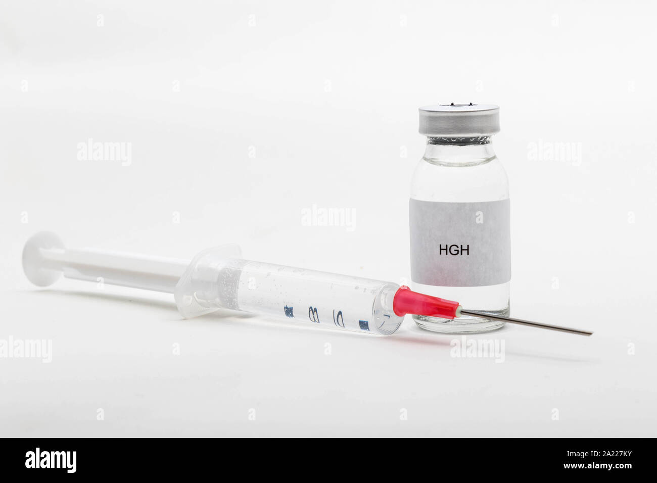 Medical concept showing medical a medical vial reading HGH and a ...