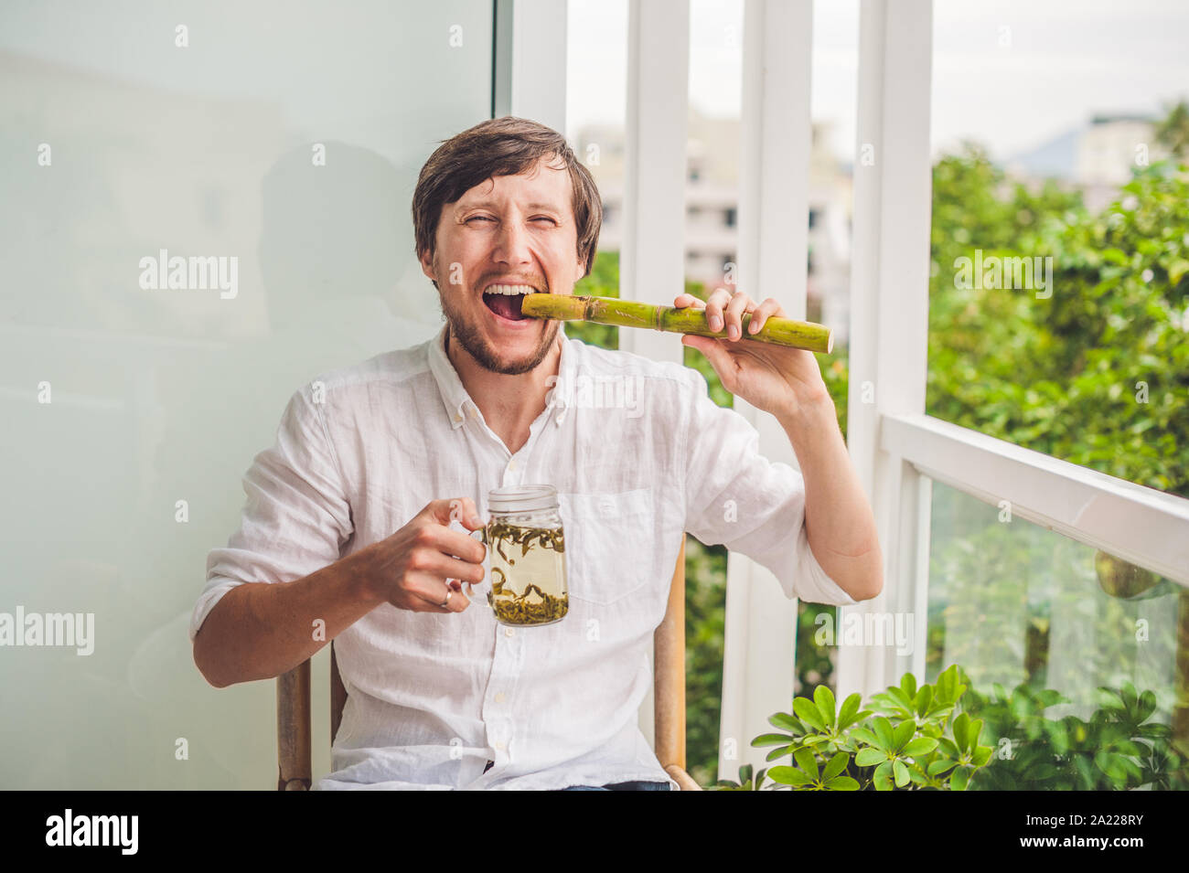 Man eating sugar cane hi-res stock photography and images - Alamy