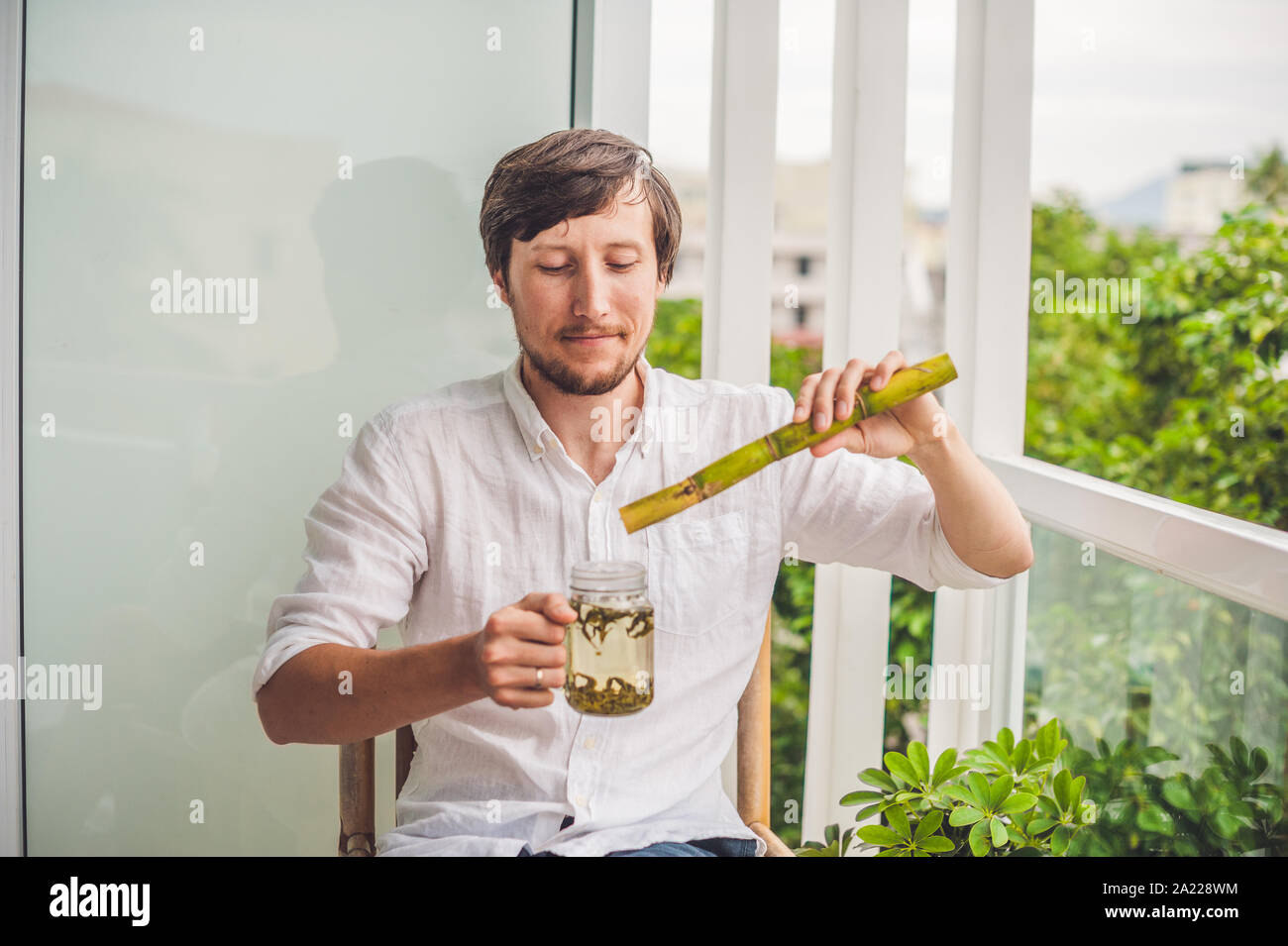 Man eating sugar cane hi-res stock photography and images - Alamy