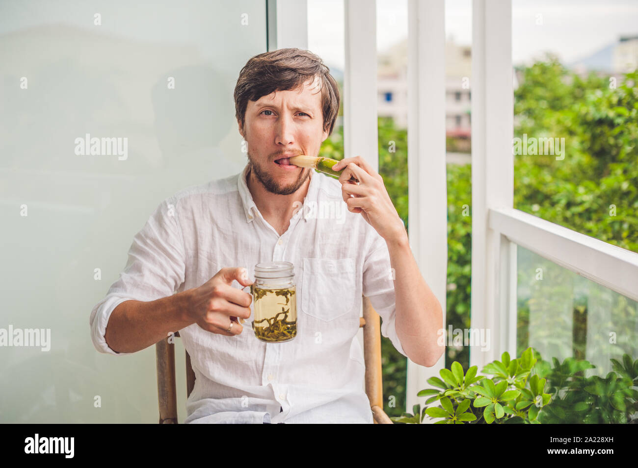 Man eating sugar cane hi-res stock photography and images - Alamy