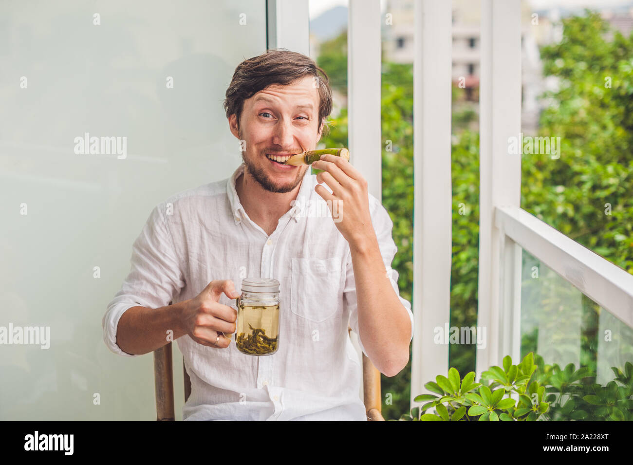 Man eating sugar cane hi-res stock photography and images - Alamy