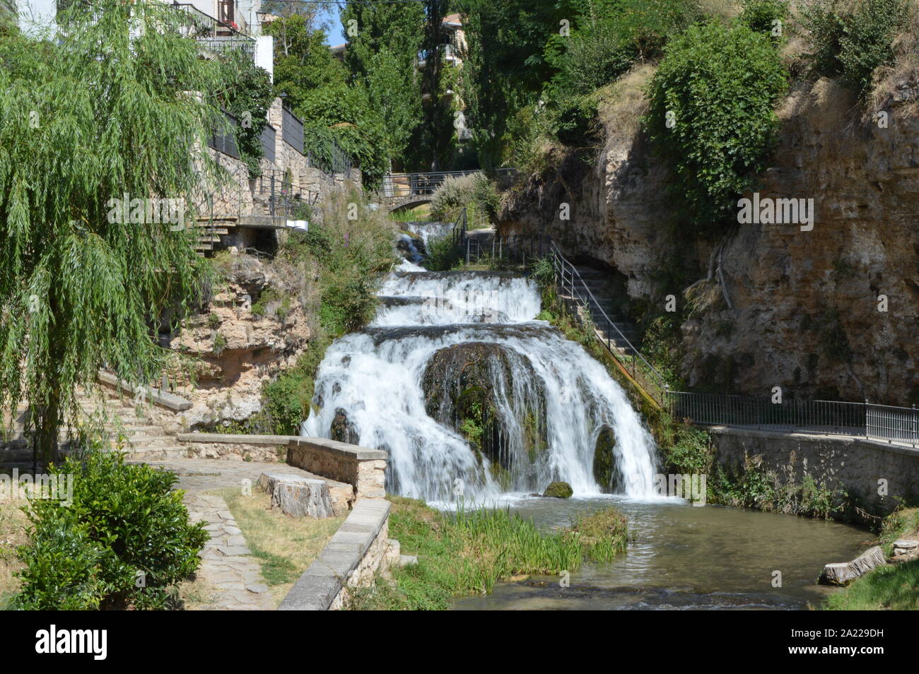 River waterfall in the city in the summer Stock Photo - Alamy