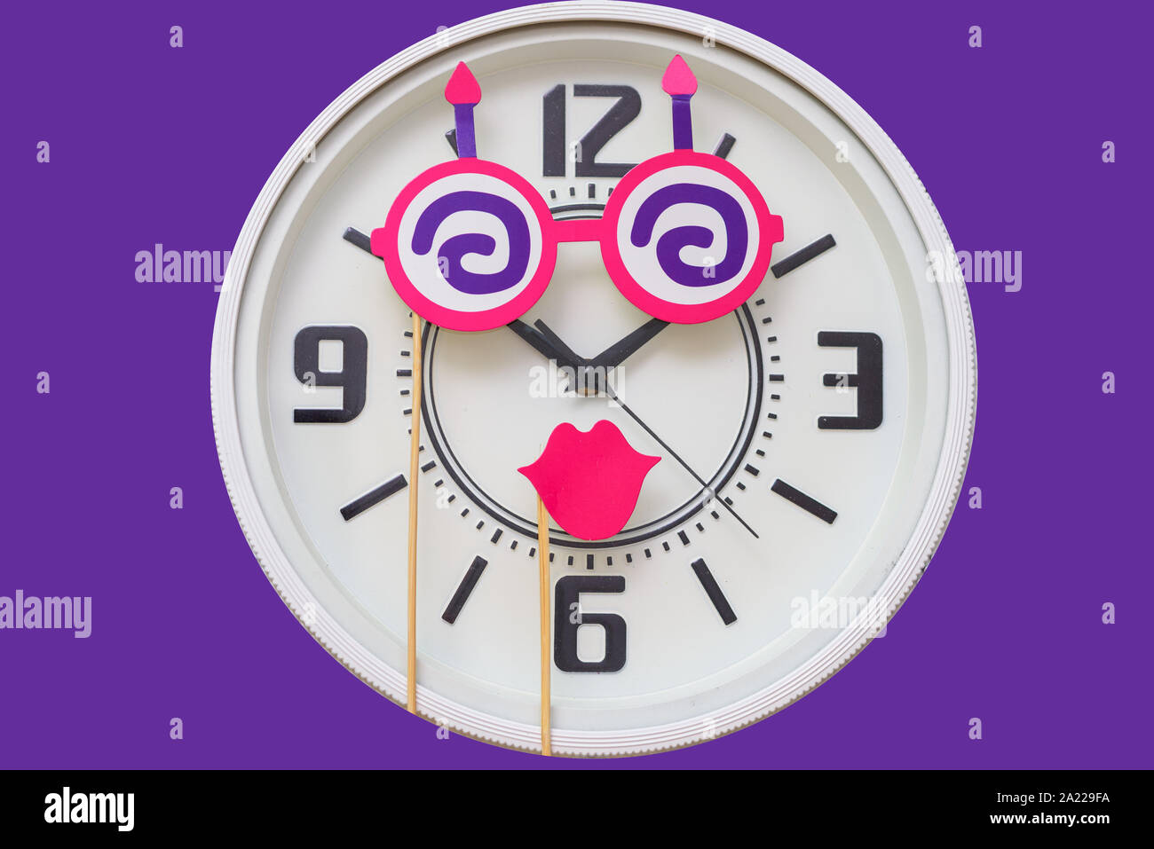 Party time.Time clock with cute paper mask glasses and lips smiling ...