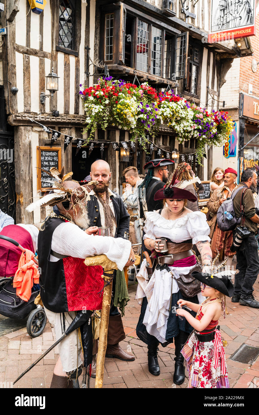 People dressed up as pirates gathering outside the Ye Olde Pumphouse ...