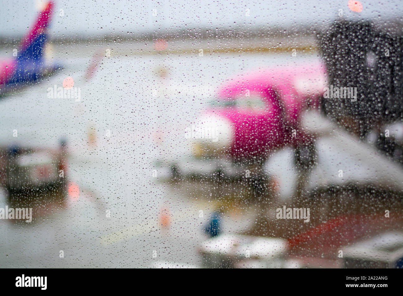 Travel in bad weather conditions concept background with water drops on ...