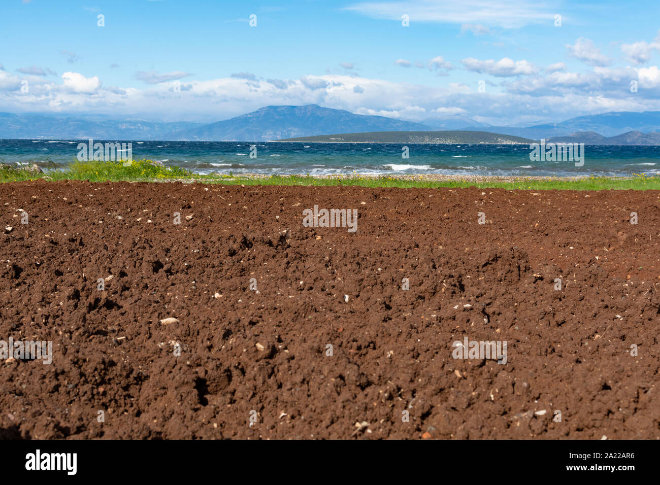 Agriculture in Greece, landscape with plowed field with fertile soil ...