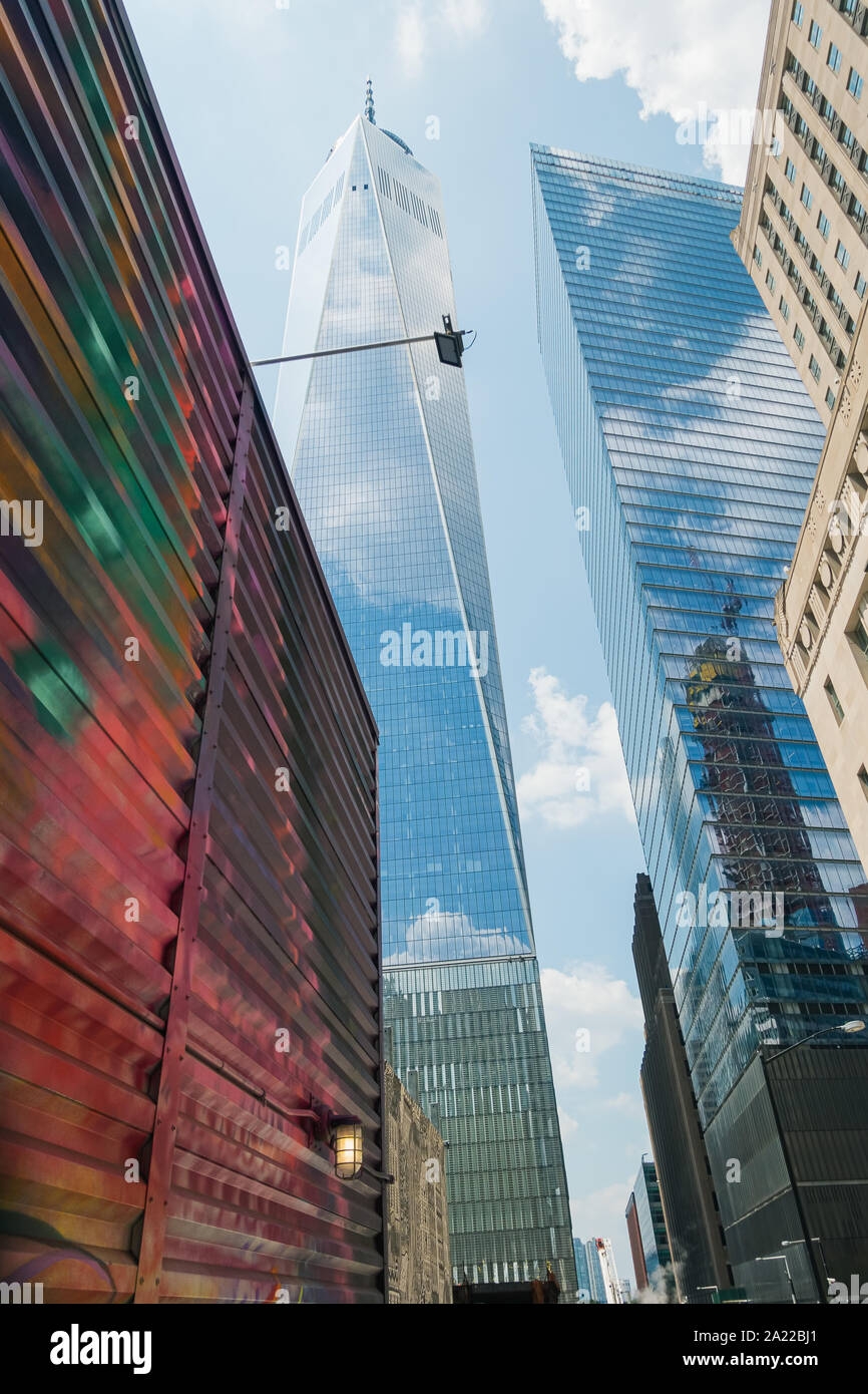 New York skyscrapers and colored buildings, buildings reflect cloudy ...