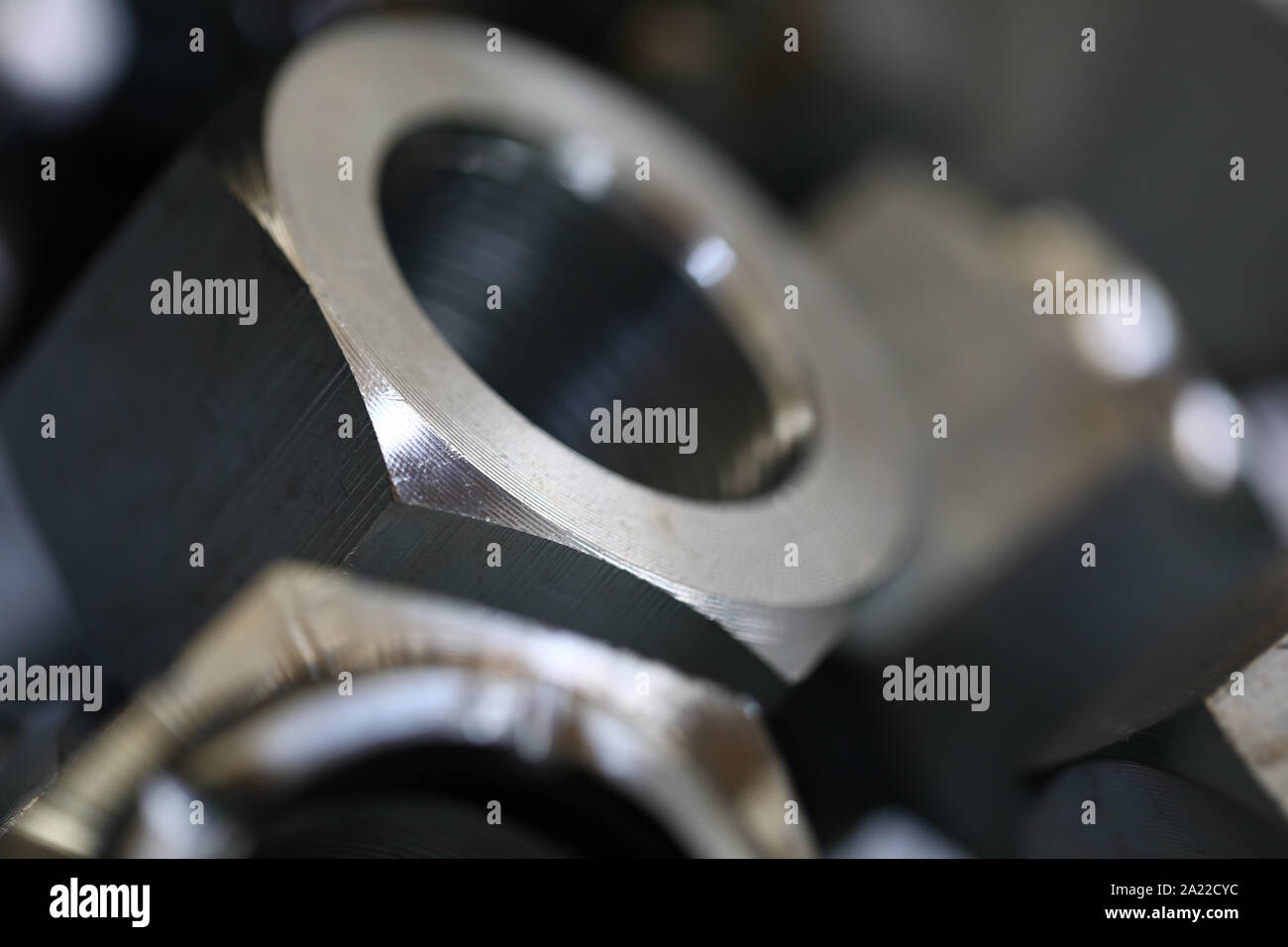 Set of shiny metal screw nuts lying in box Stock Photo - Alamy