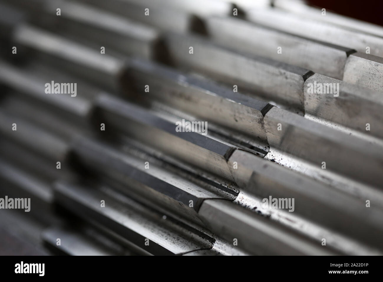 Closeup of metal cogwheel on dark background as part of full machine ...