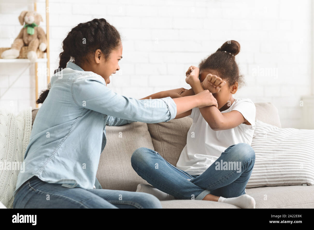 Older sister fighting younger sister hi-res stock photography and ...