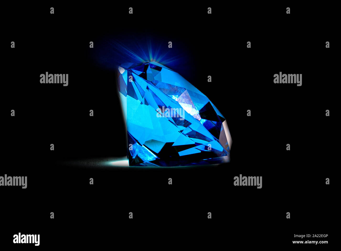 Beautiful blue diamond at isolated black background Stock Photo - Alamy